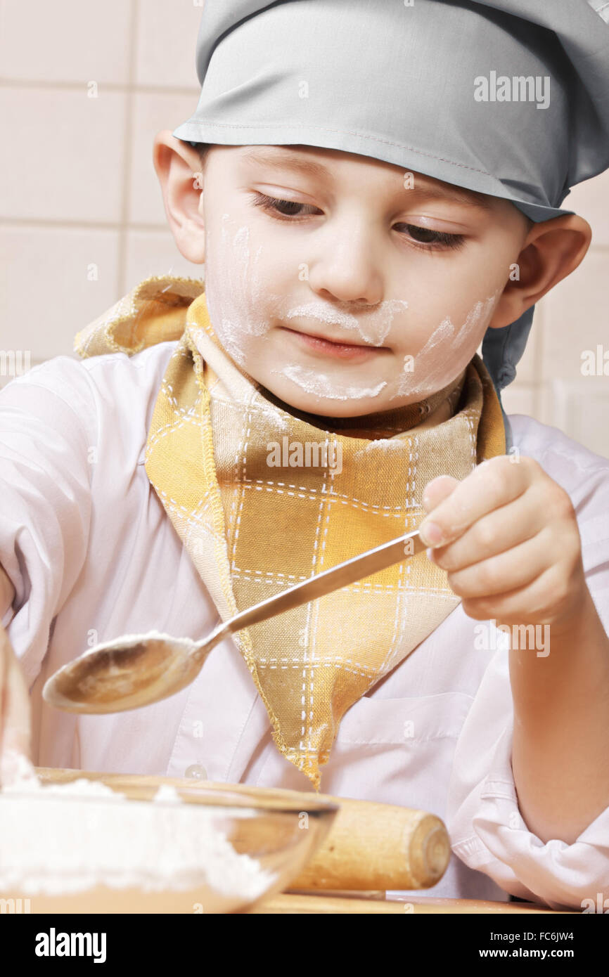 Boy cooking at the kitchen Stock Photo - Alamy