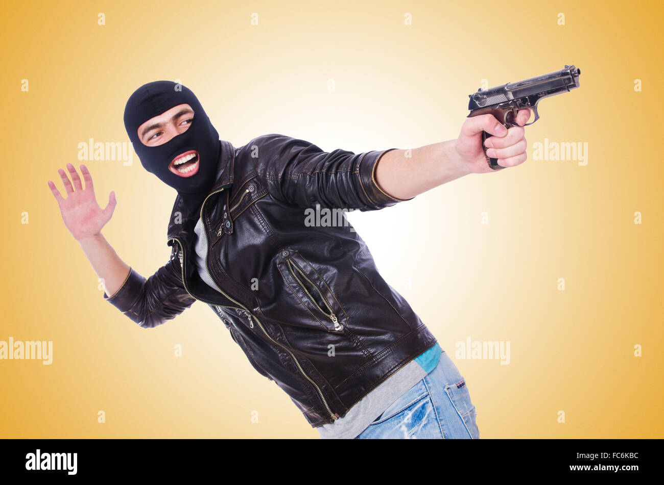 Young thug with gun isolated on white Stock Photo - Alamy