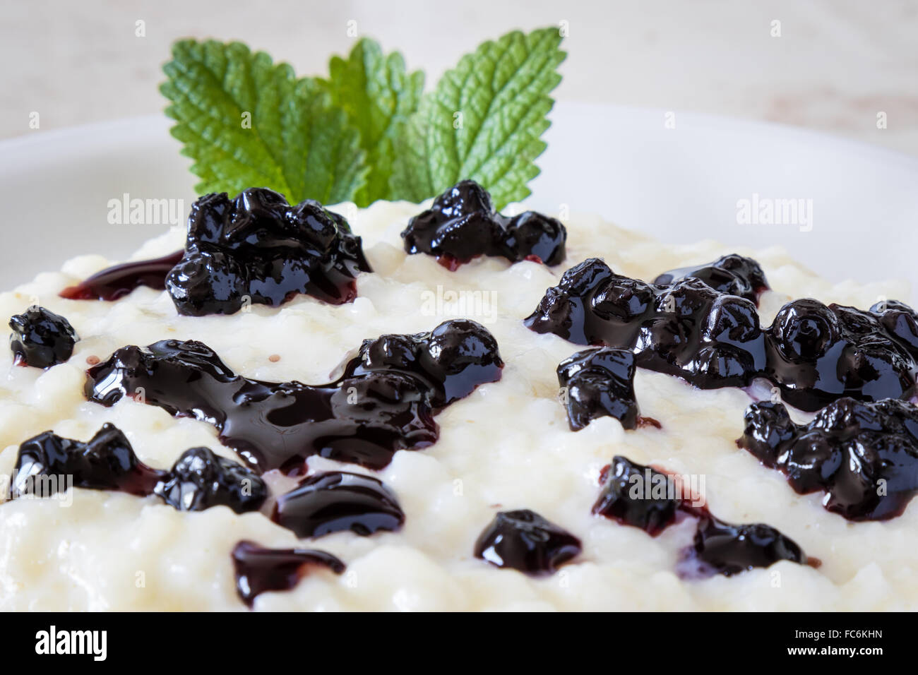 rice pudding with blueberry cream Stock Photo - Alamy