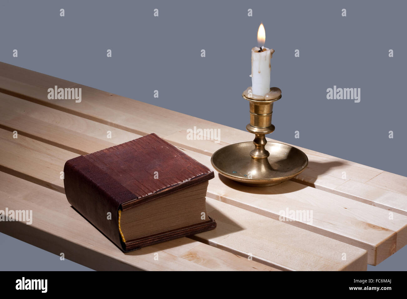 Book And Candle Stock Photo - Alamy