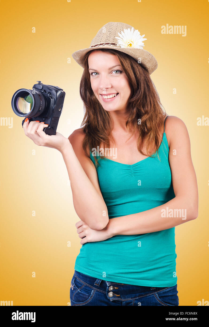 Attractive female photographer on white Stock Photo - Alamy