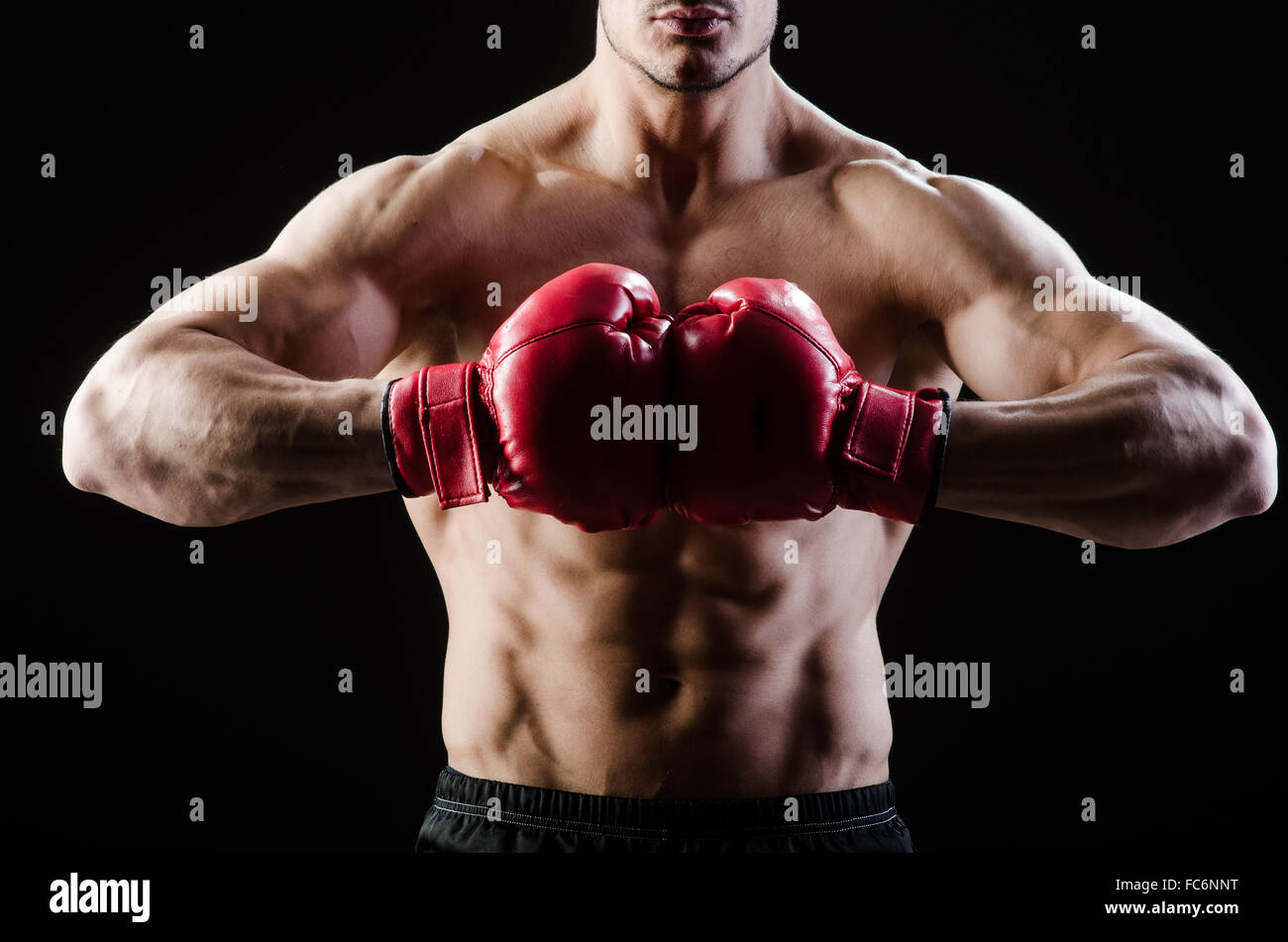 Muscular man in boxing concept Stock Photo - Alamy