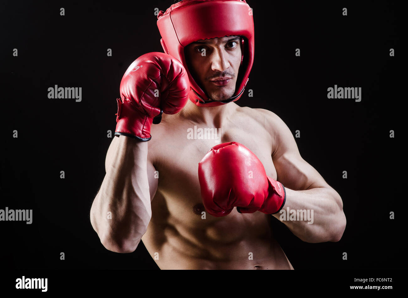 Muscular man in boxing concept Stock Photo - Alamy