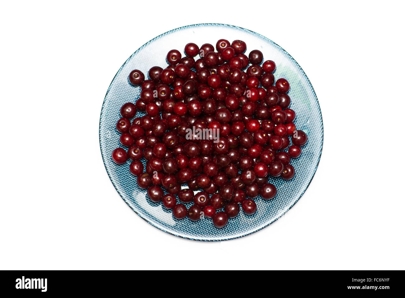 Plate full of cherries isolated on white Stock Photo - Alamy