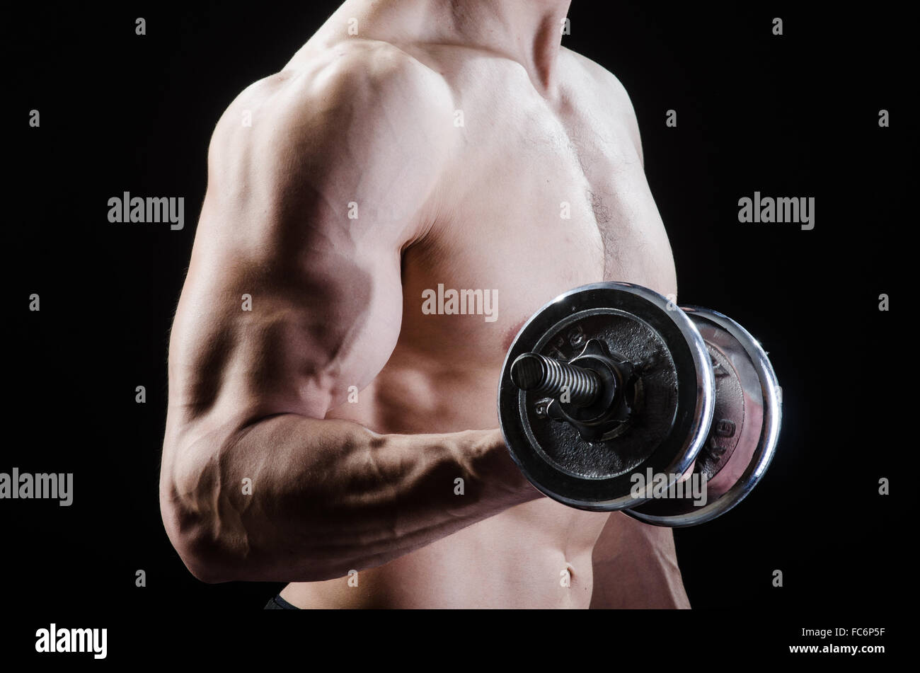 Muscular ripped bodybuilder with dumbbells Stock Photo - Alamy