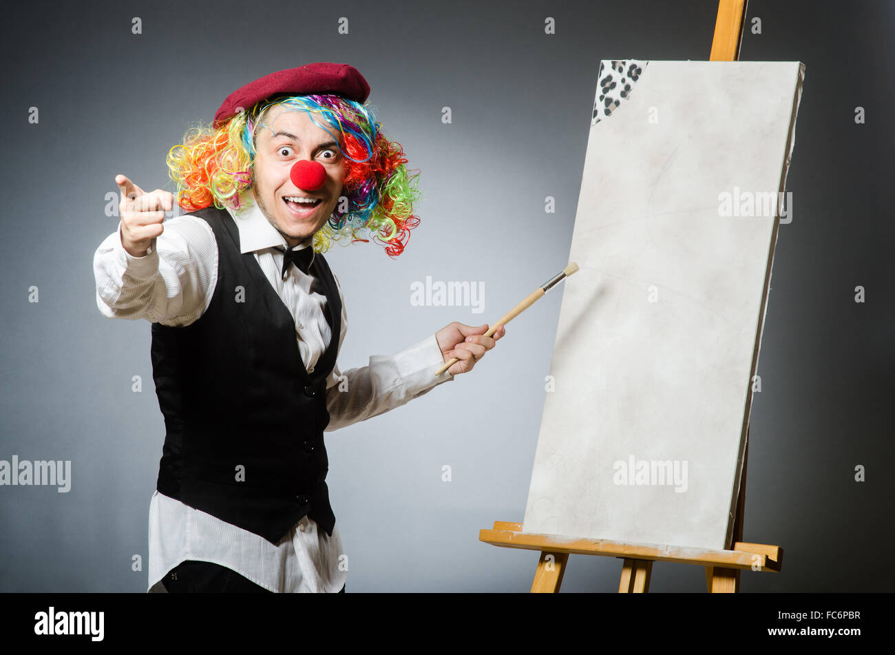 Funny artist in dark studio Stock Photo - Alamy