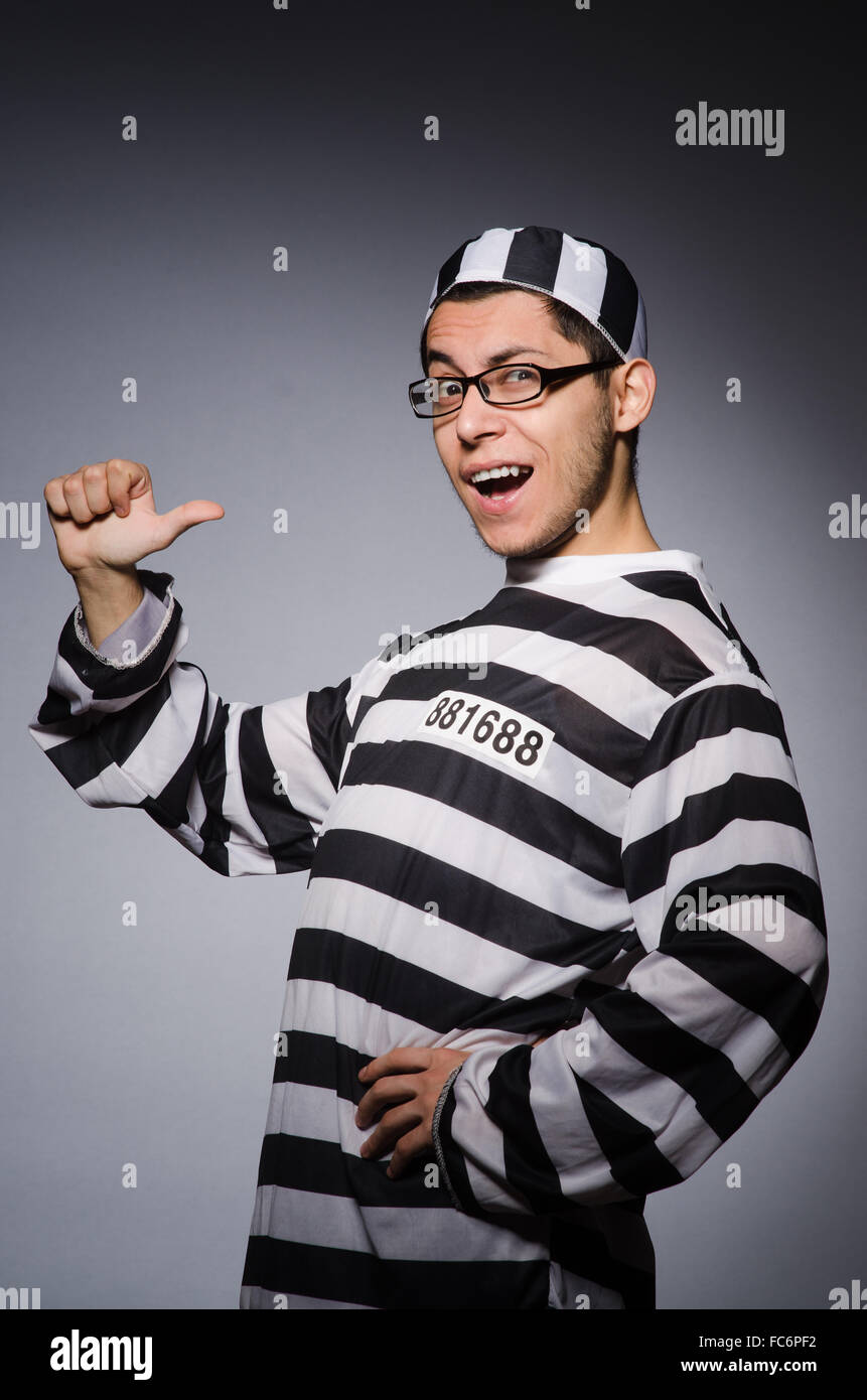 Young prisoner against gray Stock Photo - Alamy