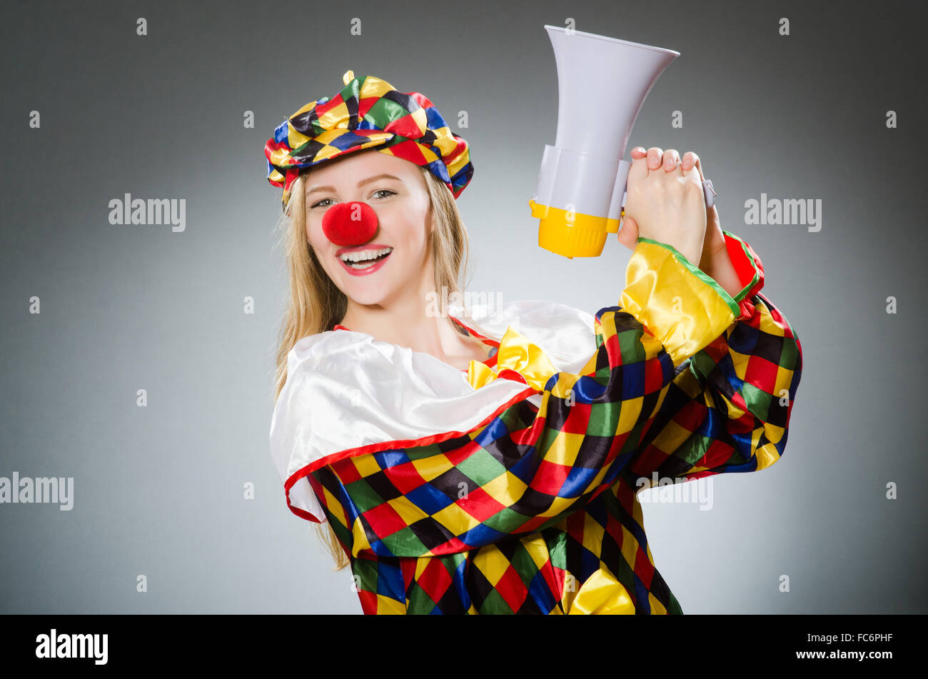 Clown with loudspeaker isolated on white Stock Photo - Alamy