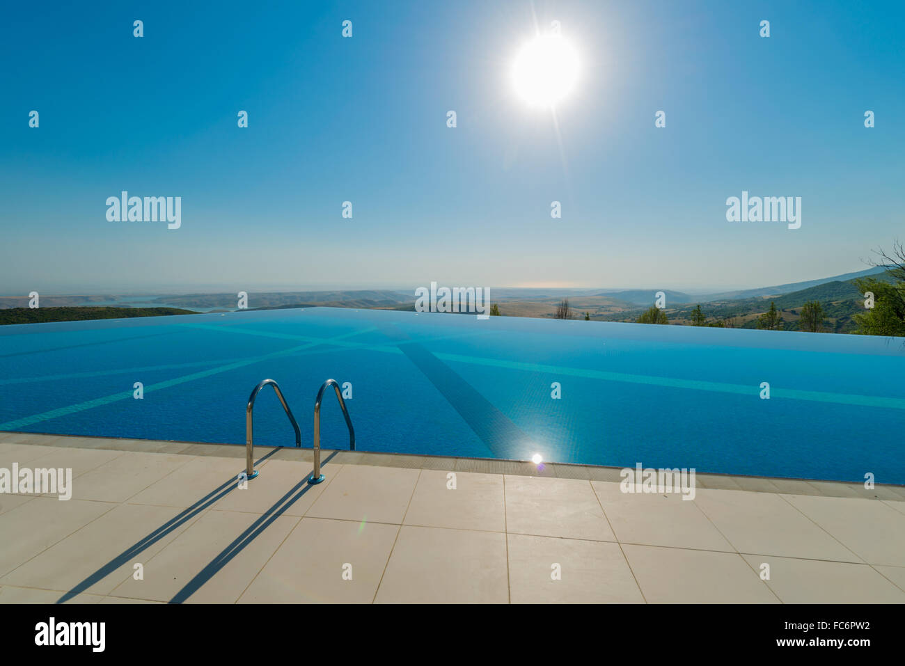 Infinity pool on the bright summer day Stock Photo - Alamy