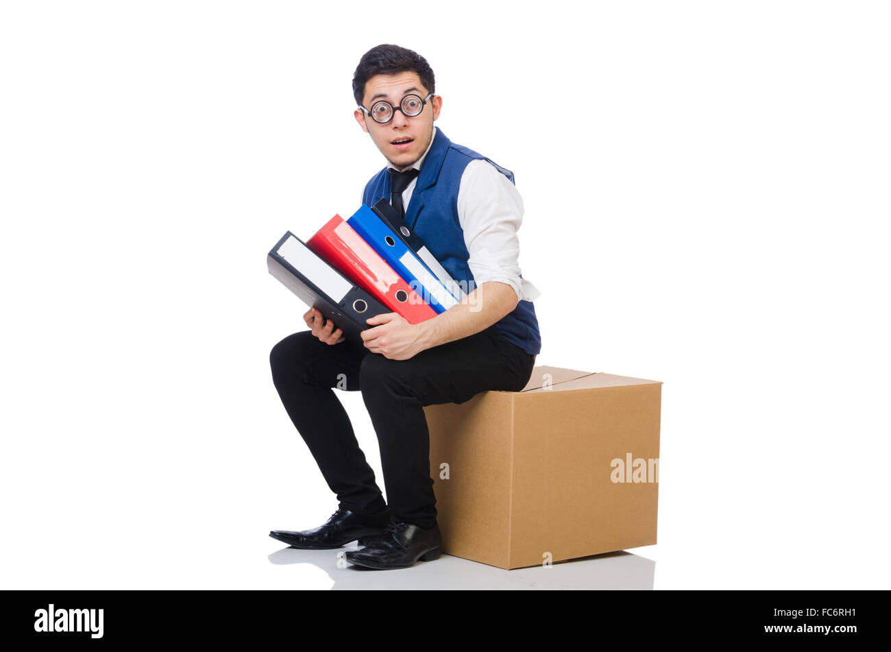 Young employee sitting on the box isolated on white Stock Photo - Alamy