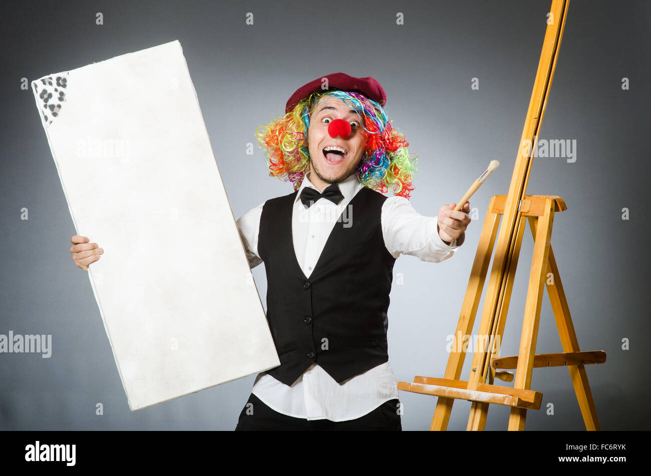 Funny artist in dark studio Stock Photo - Alamy