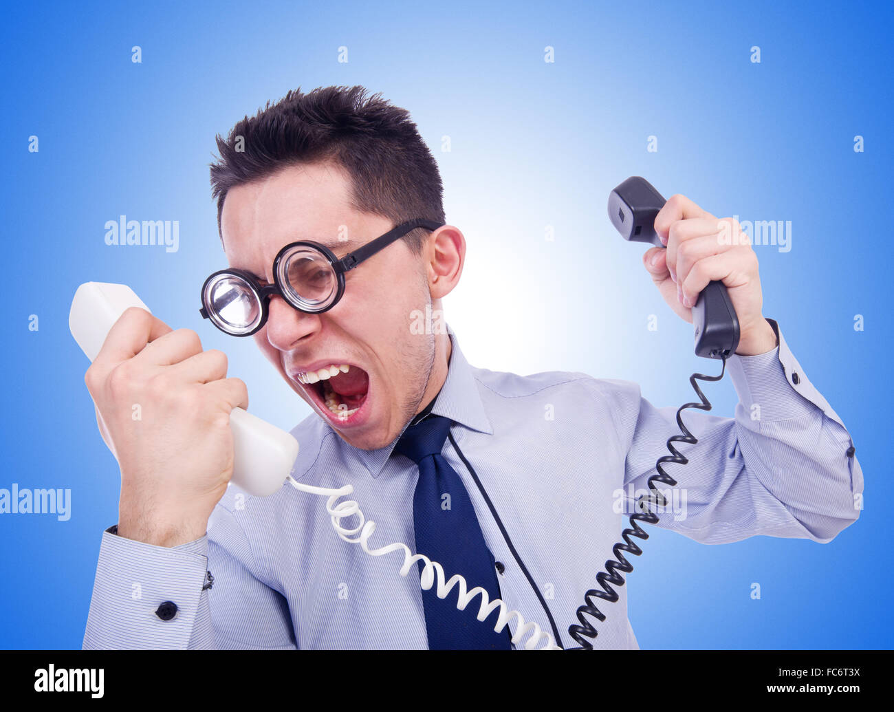 Crazy man with phone on white Stock Photo - Alamy