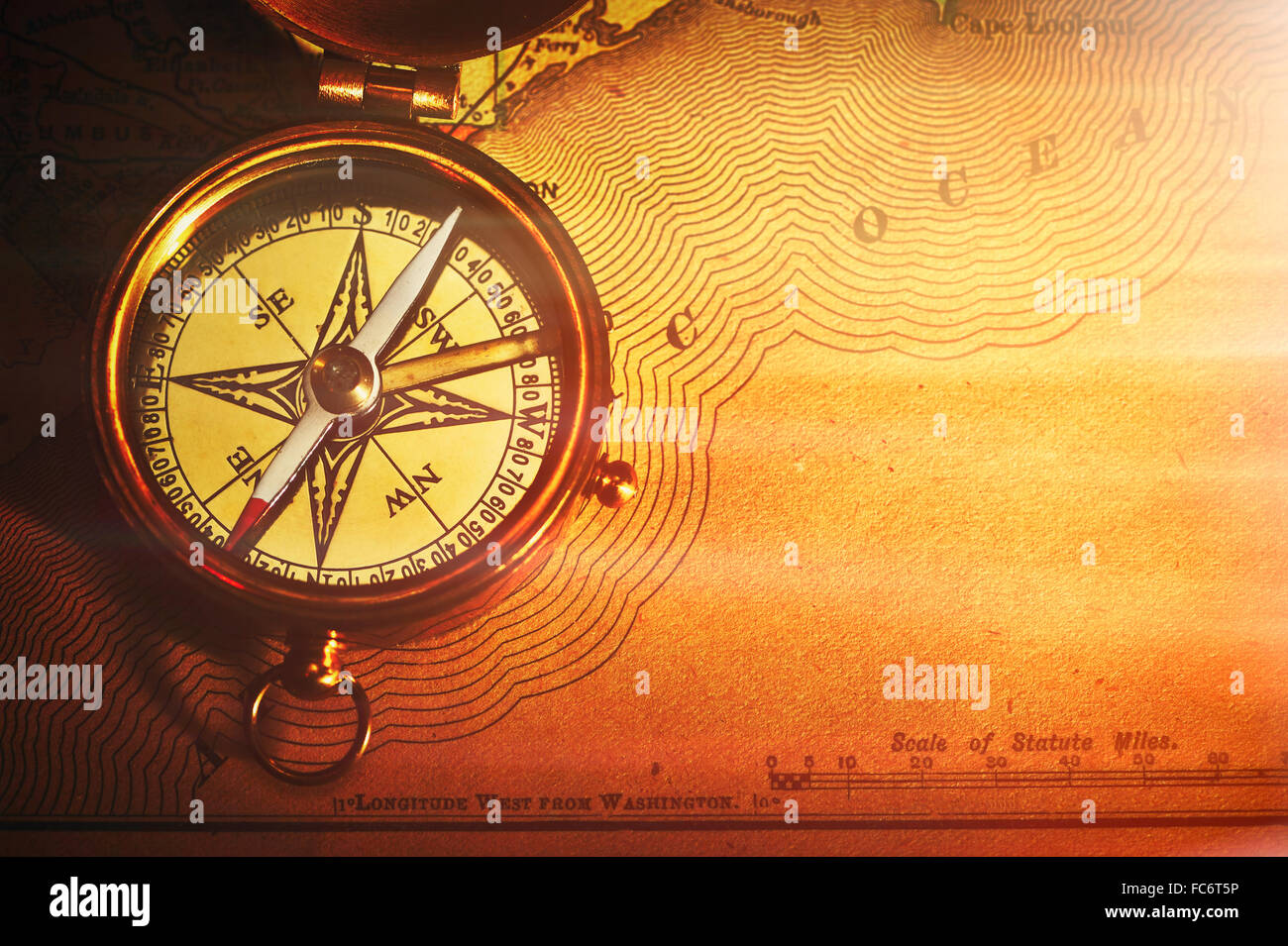 Antique brass compass over old USA map Stock Photo - Alamy