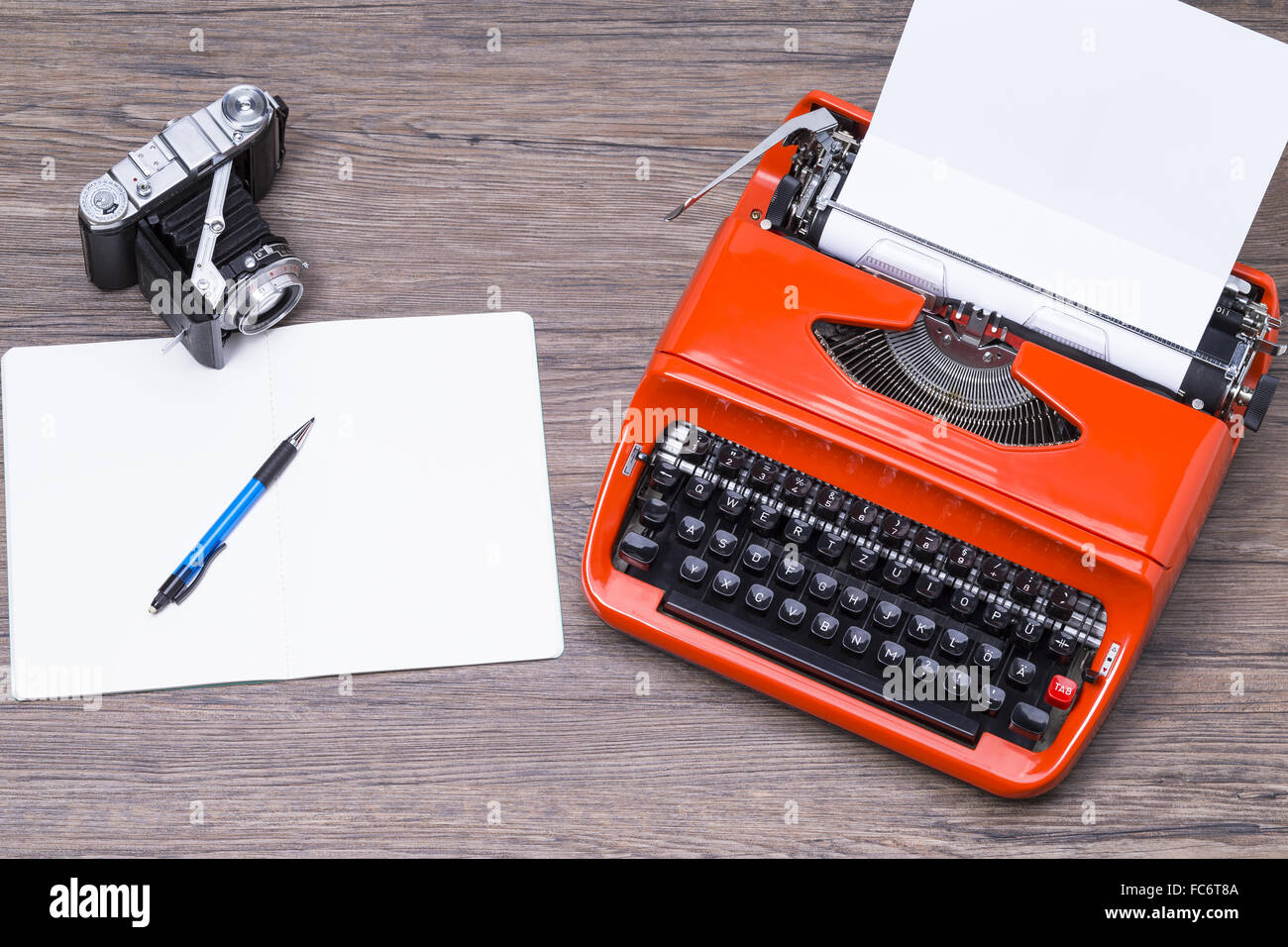 Notepad and camera Stock Photo - Alamy