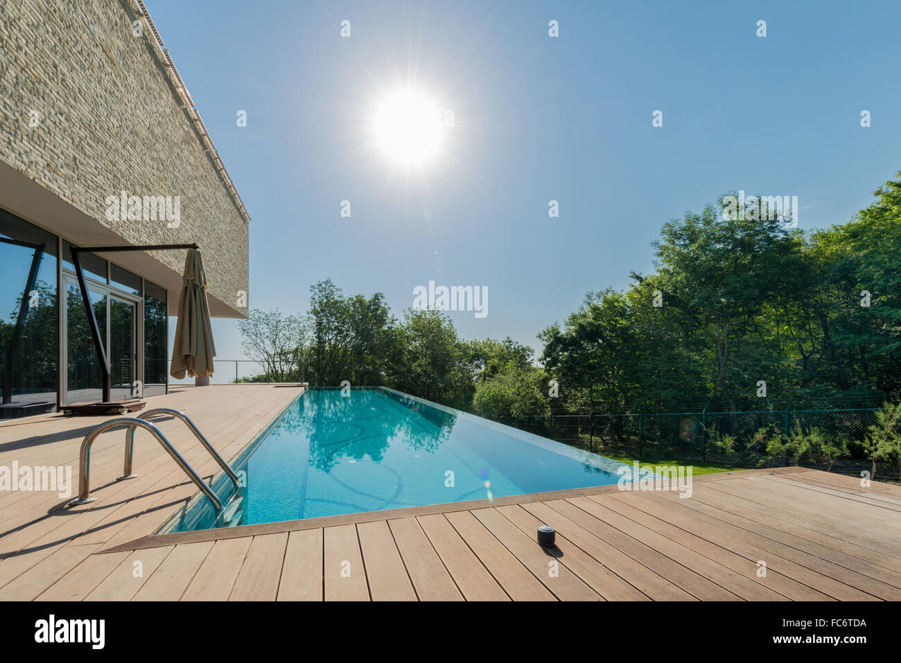 Infinity pool on the bright summer day Stock Photo - Alamy