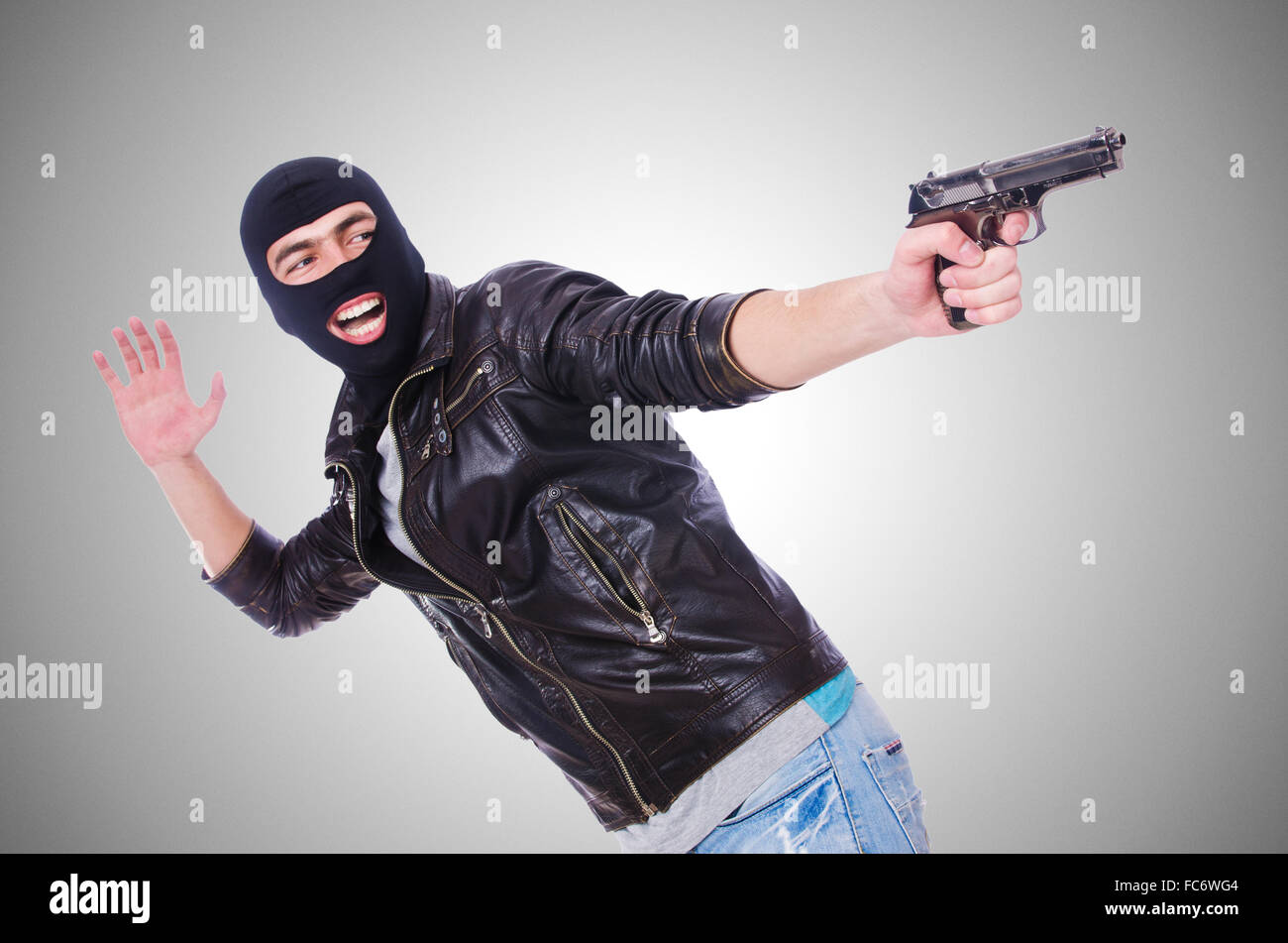 Young thug with gun isolated on white Stock Photo - Alamy