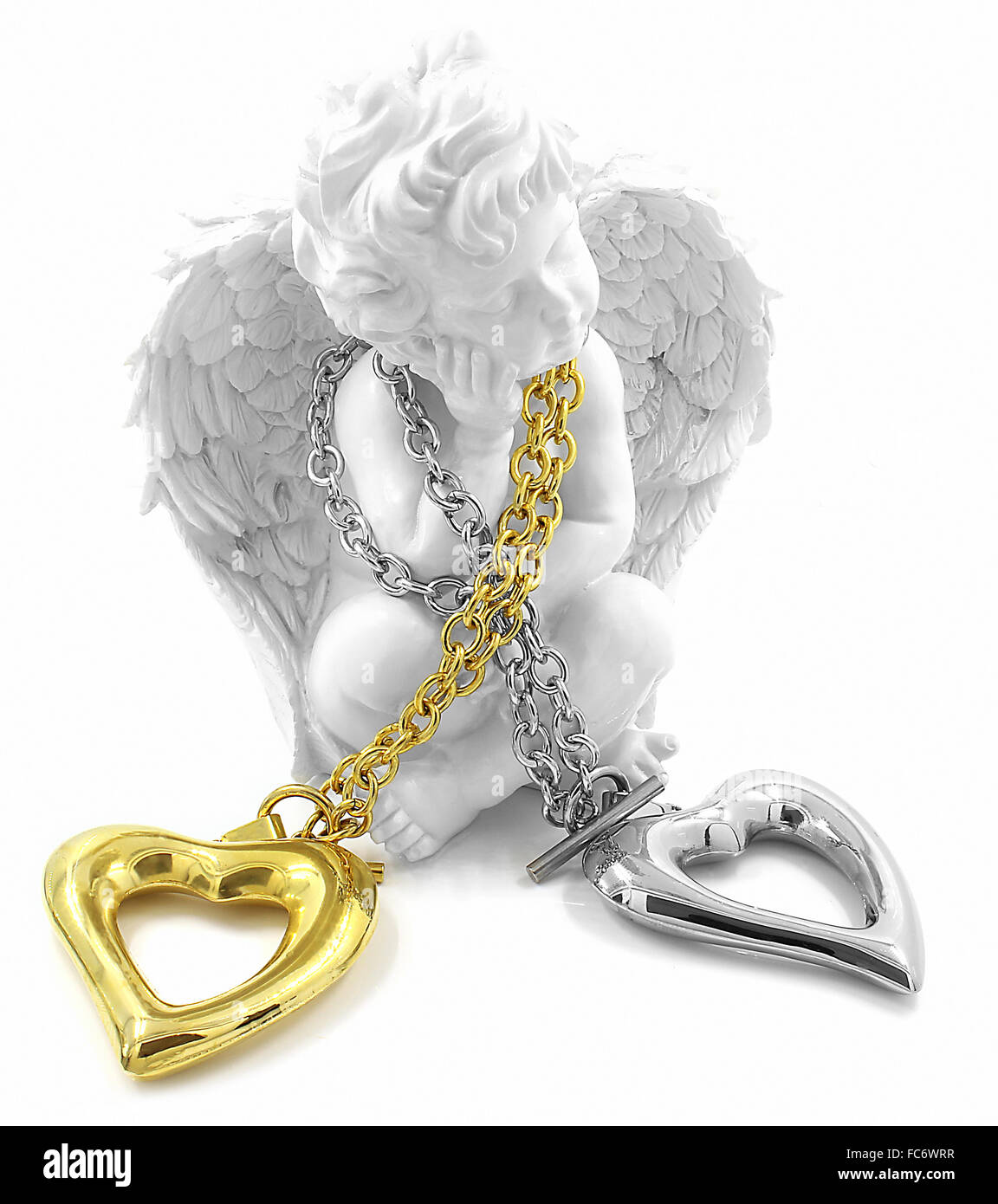 Necklace heart and angel Stock Photo - Alamy