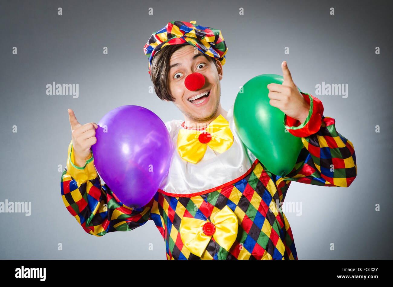 Funny clown in comical concept Stock Photo - Alamy
