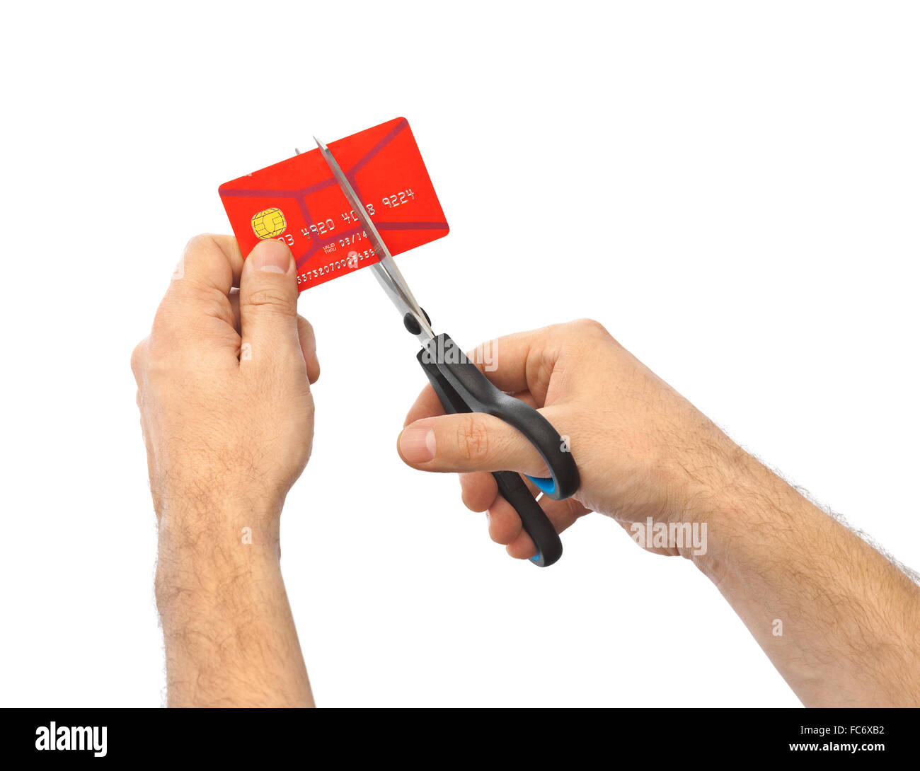Scissors cutting old credit card Stock Photo - Alamy