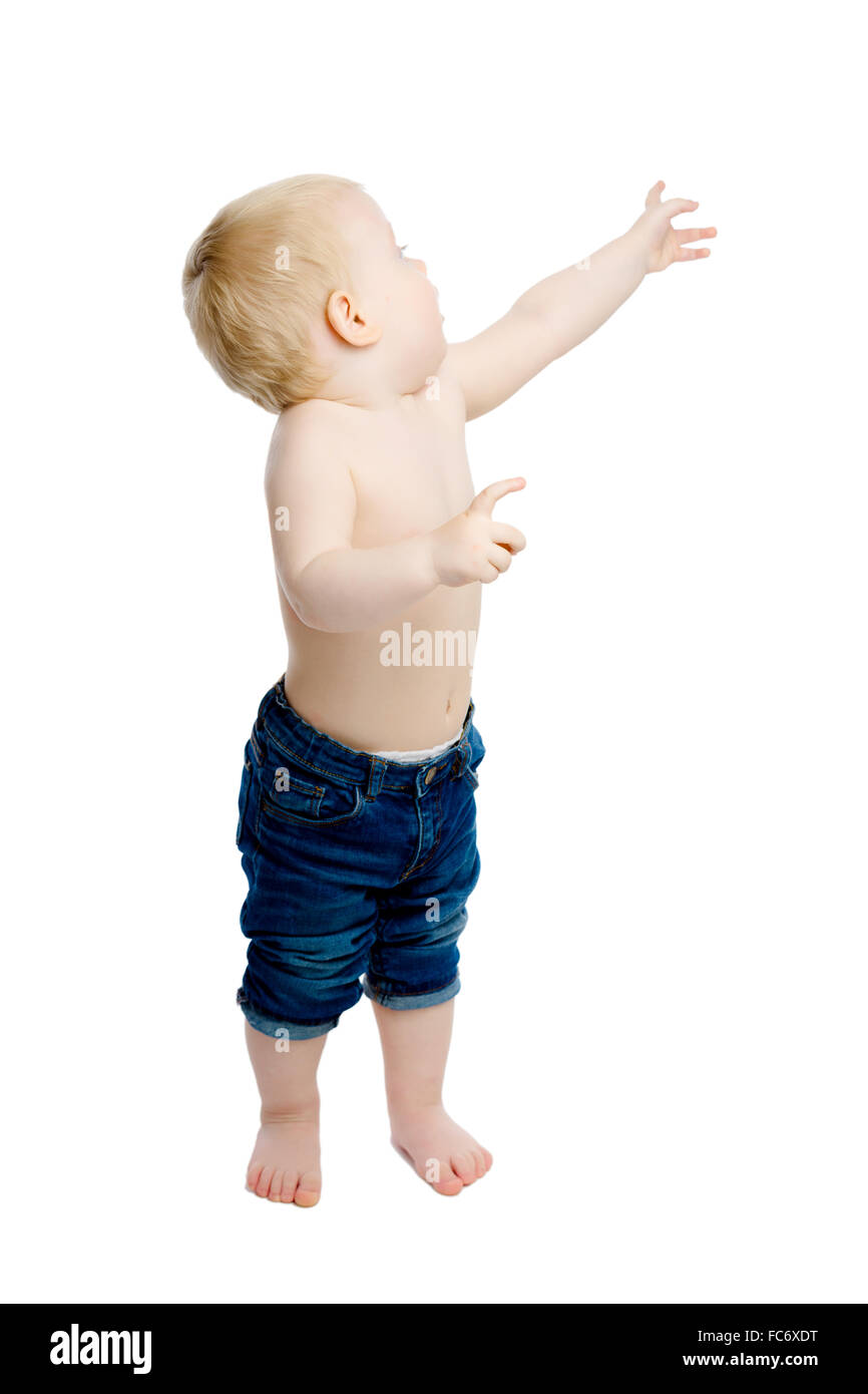little boy at the shows to something Stock Photo - Alamy