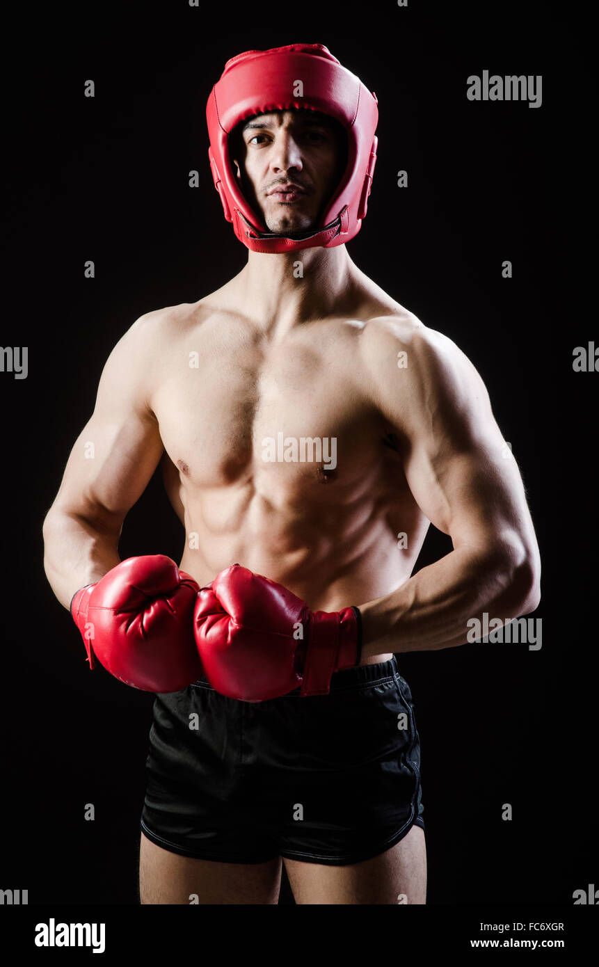 Muscular man in boxing concept Stock Photo - Alamy