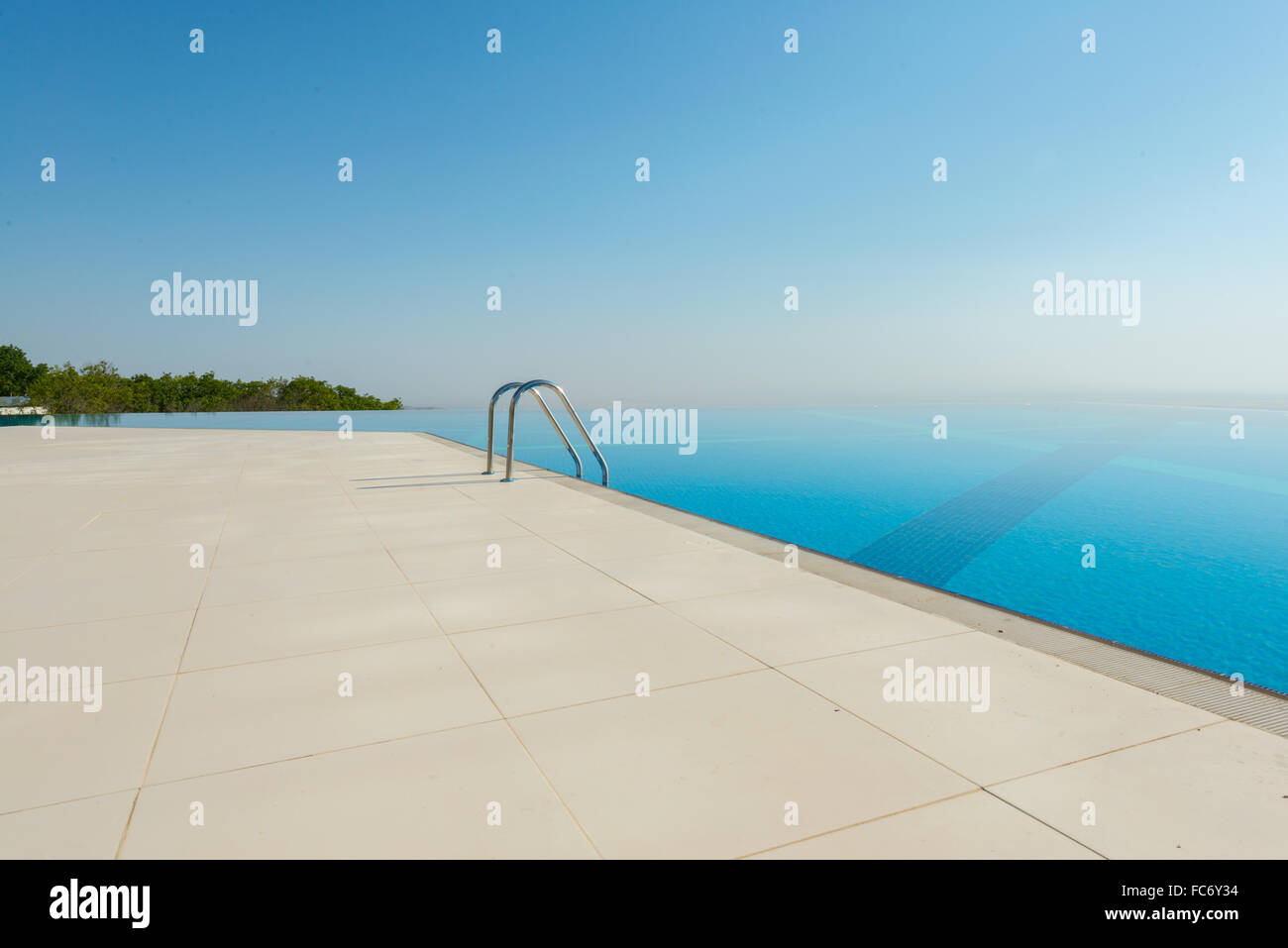 Infinity pool on the bright summer day Stock Photo - Alamy