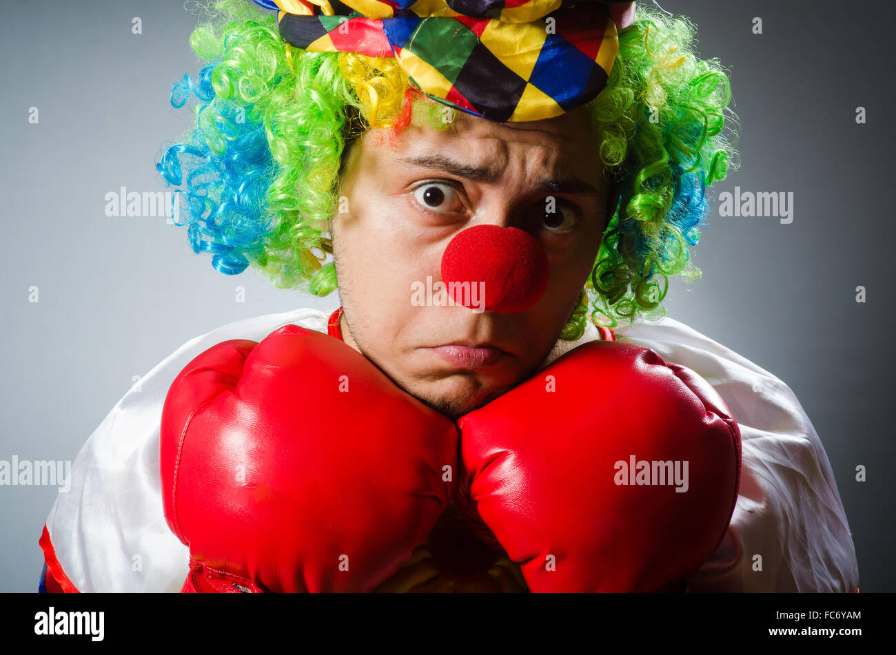Funny clown in comical concept Stock Photo - Alamy