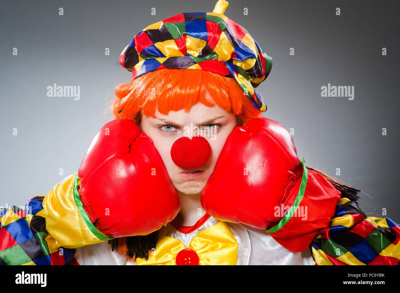 Funny clown in comical concept Stock Photo - Alamy