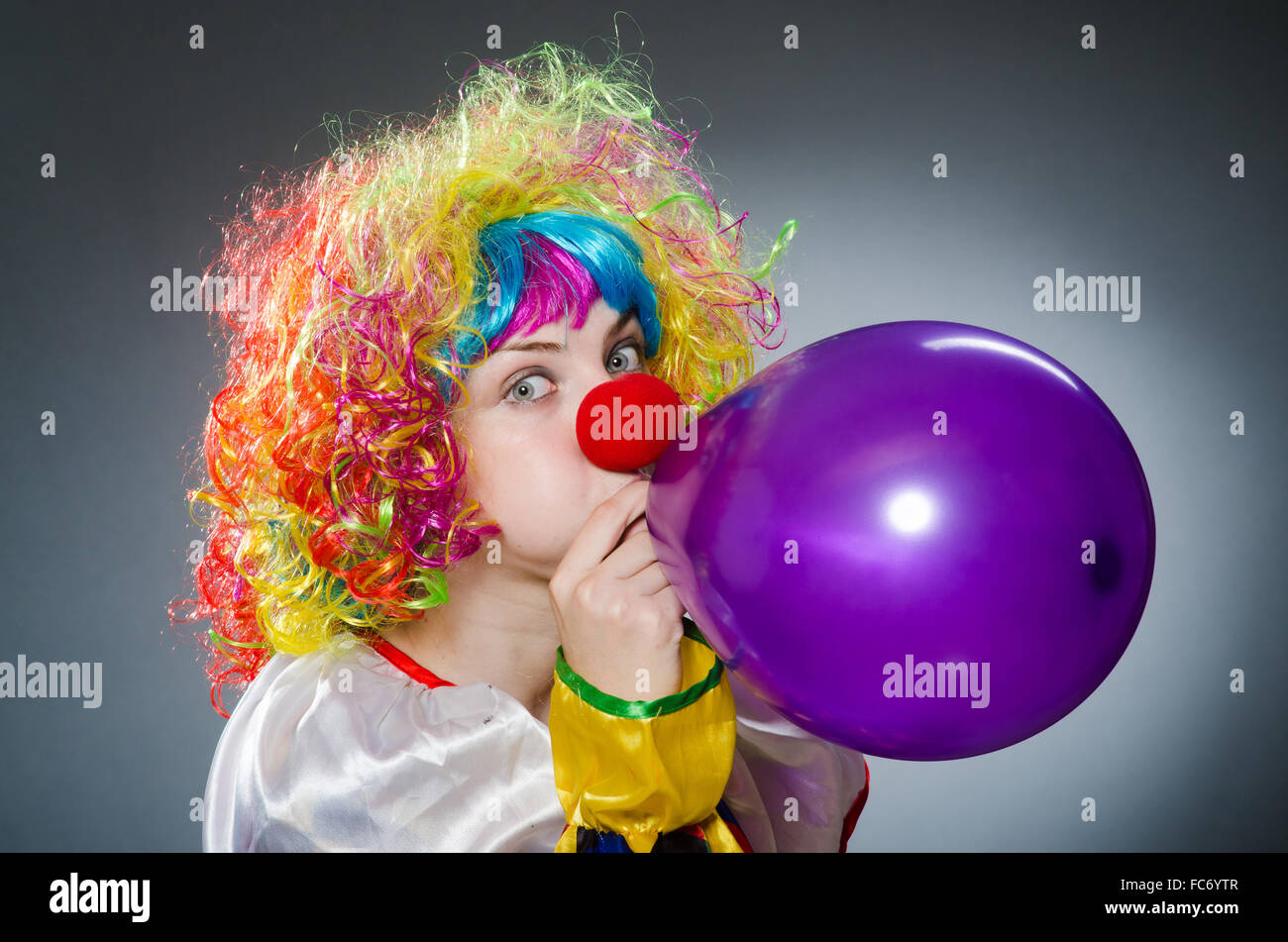 Funny clown in comical concept Stock Photo - Alamy