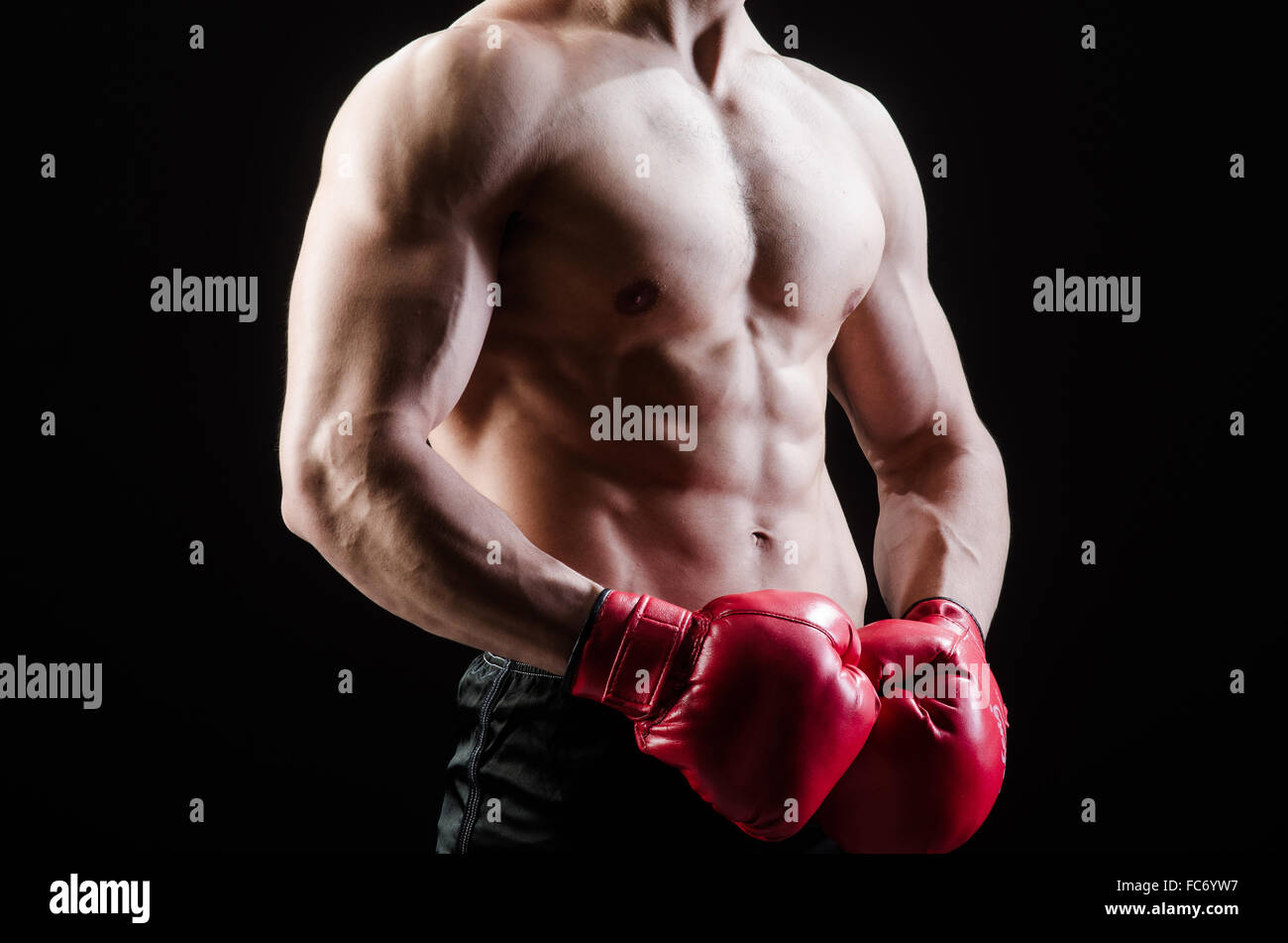 Muscular man in boxing concept Stock Photo - Alamy