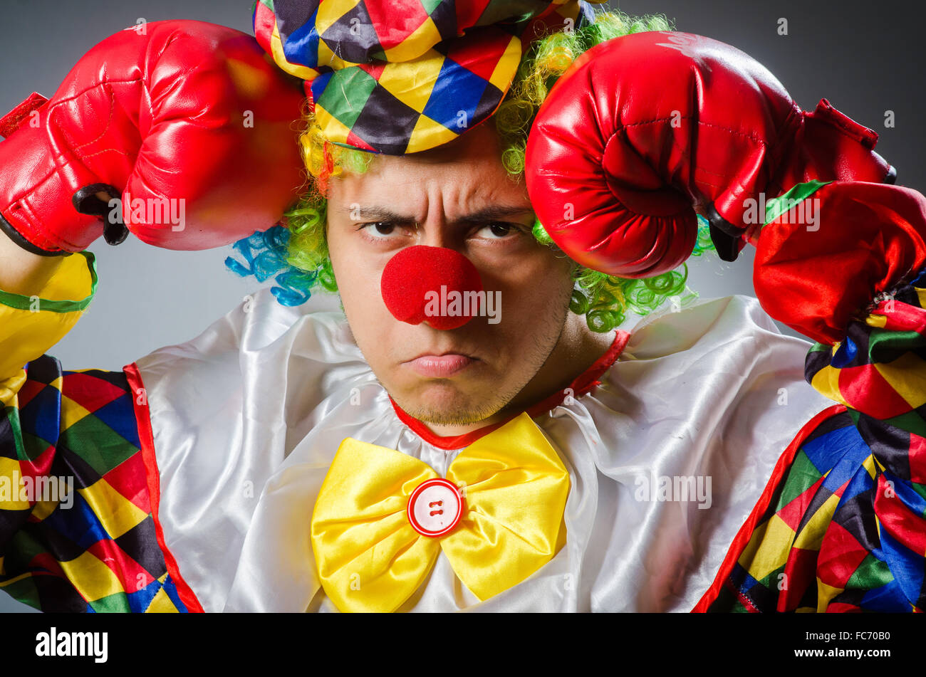 Funny clown in comical concept Stock Photo - Alamy