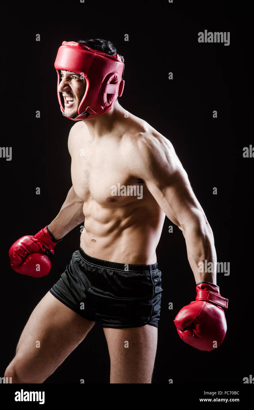 Muscular man in boxing concept Stock Photo - Alamy