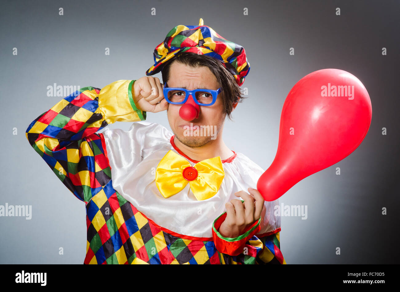 Funny clown in comical concept Stock Photo - Alamy