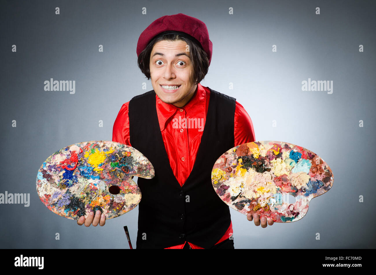 Funny artist in dark studio Stock Photo - Alamy