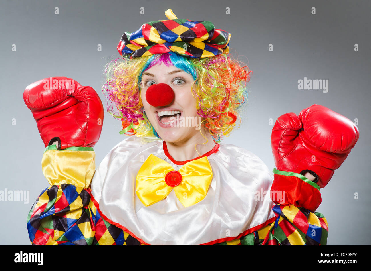 Clown with boxing gloves isolated on white Stock Photo - Alamy