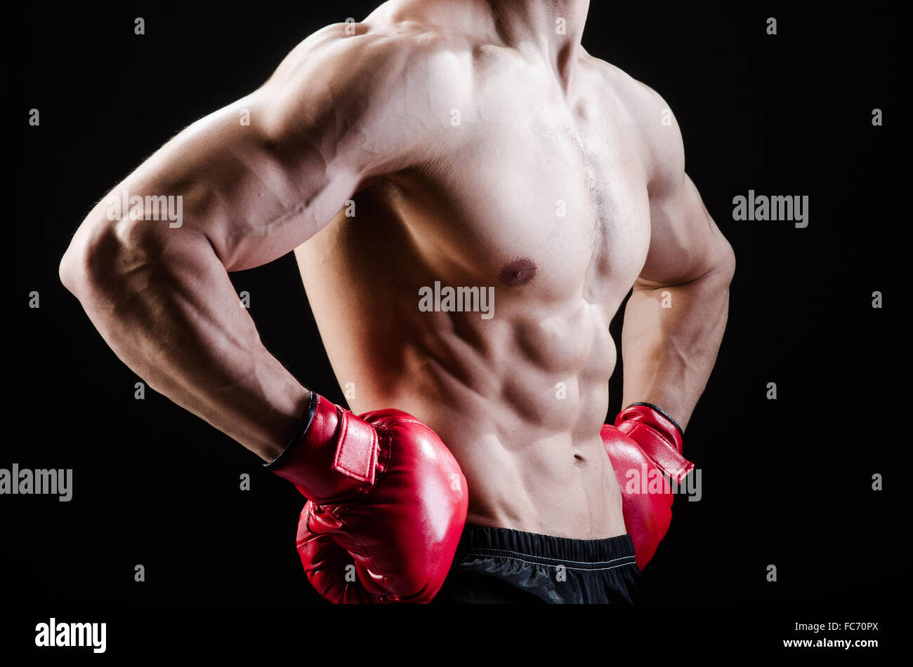 Muscular man in boxing concept Stock Photo - Alamy