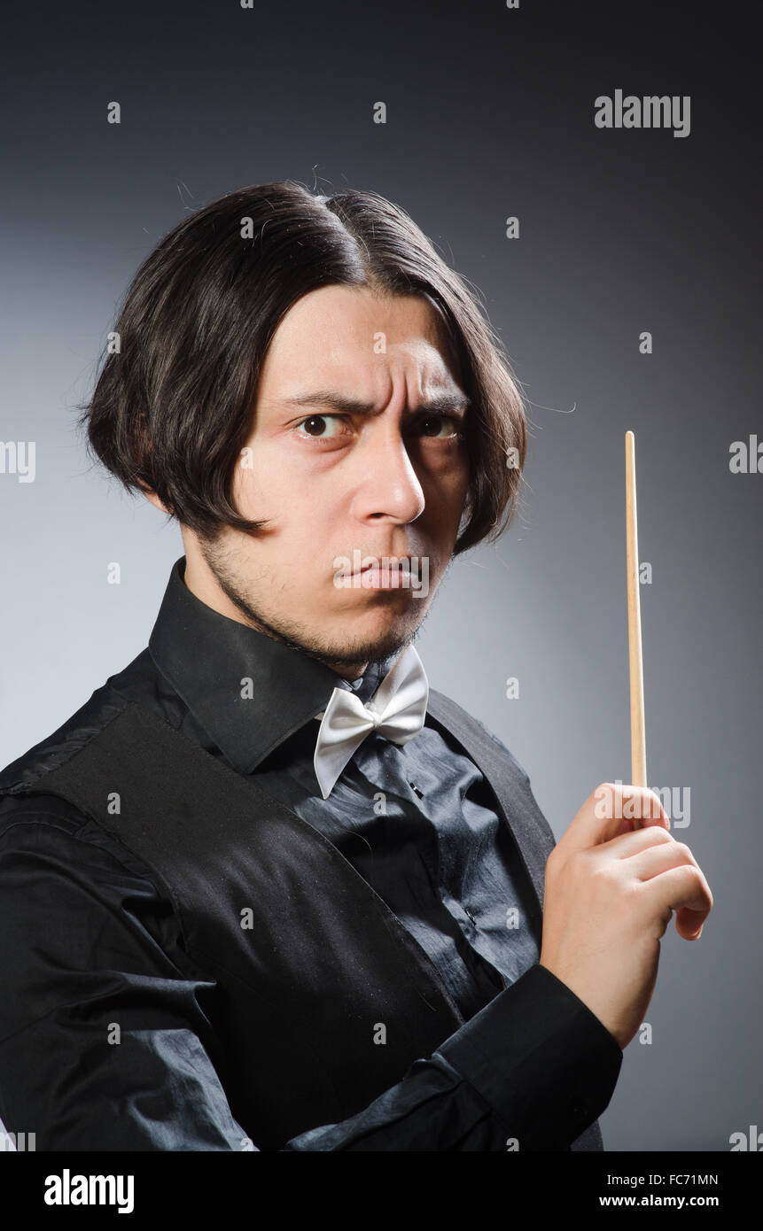 Funny conductor in musical concept Stock Photo - Alamy
