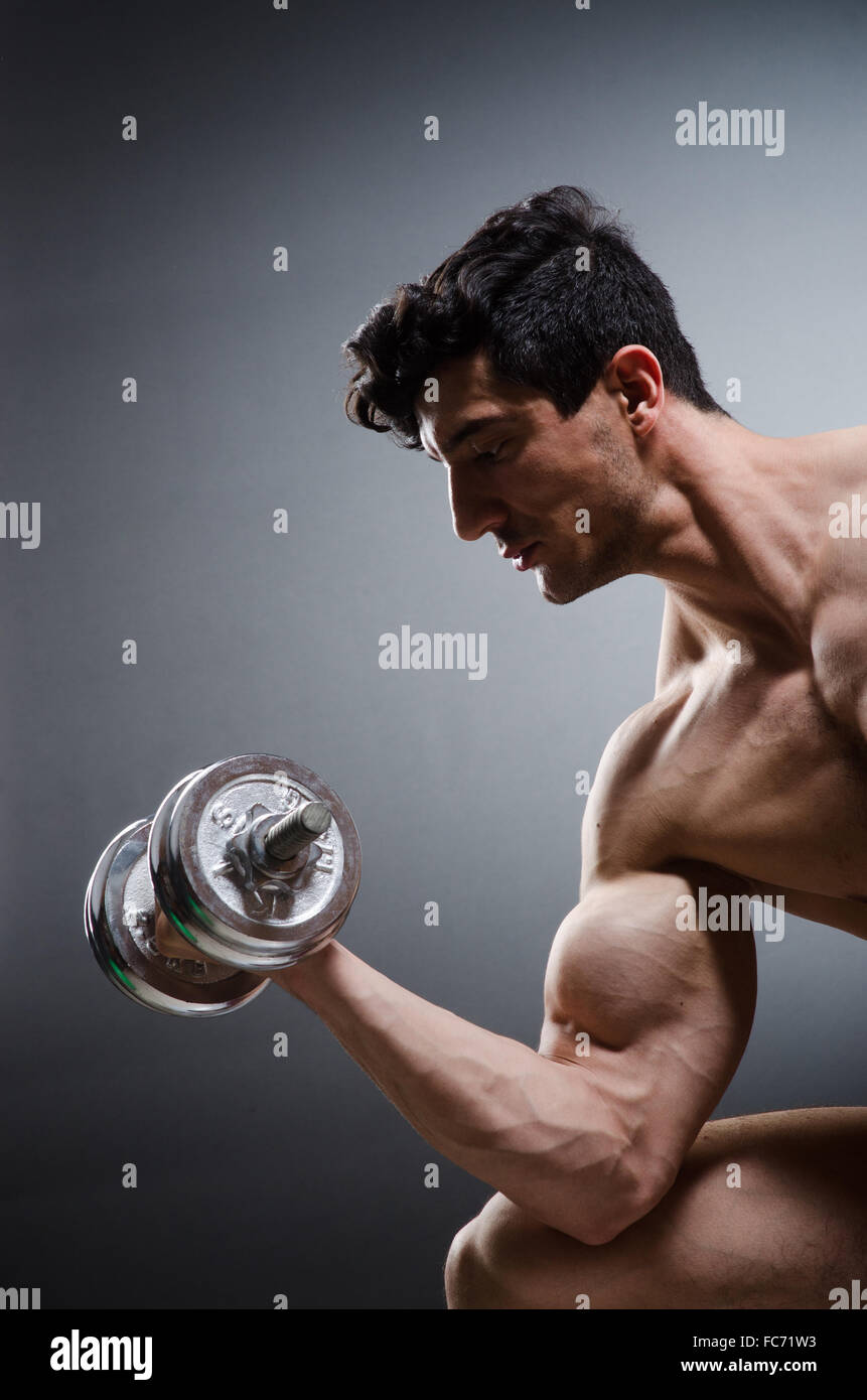 Muscular ripped bodybuilder with dumbbells Stock Photo - Alamy