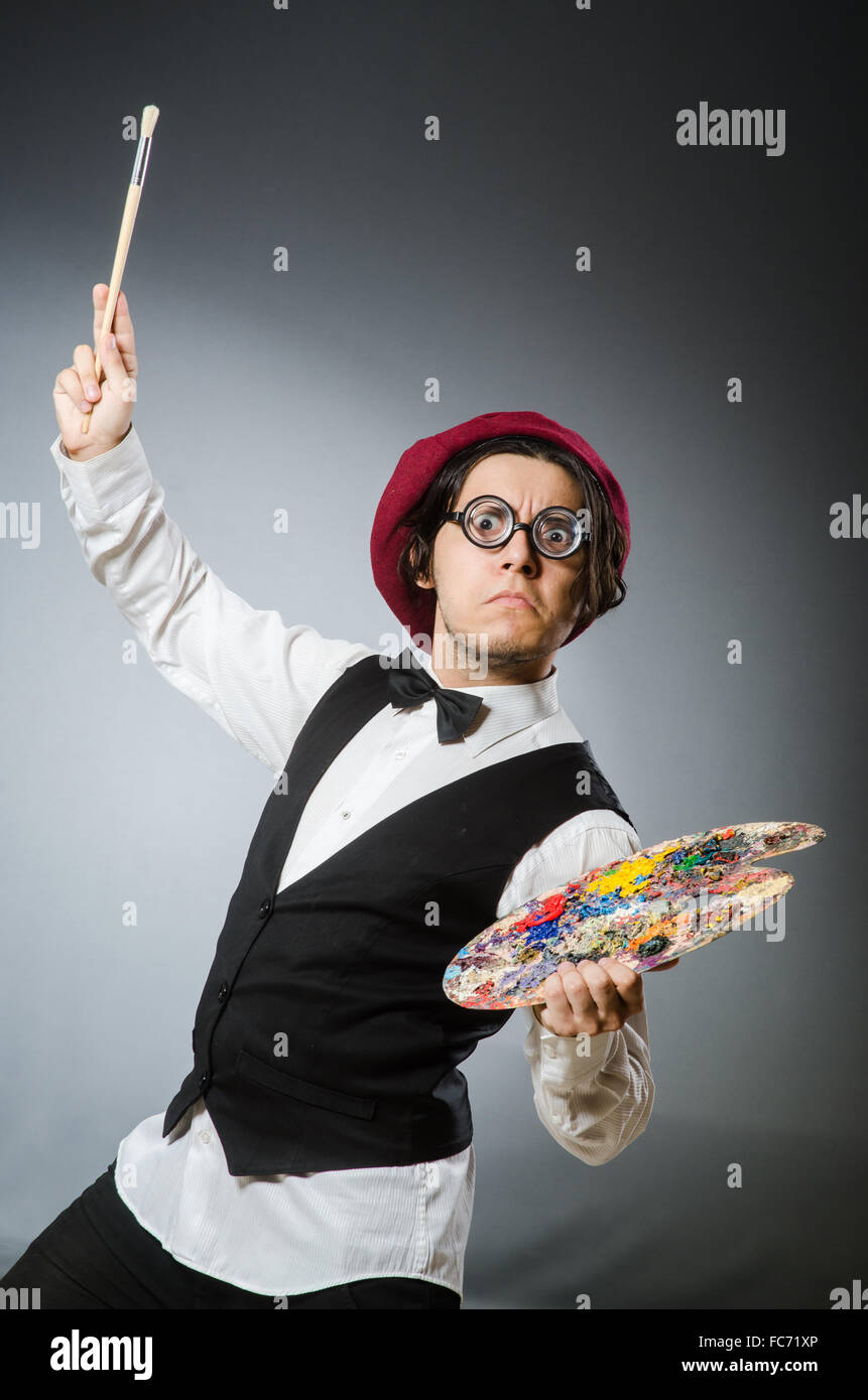 Funny artist in dark studio Stock Photo - Alamy