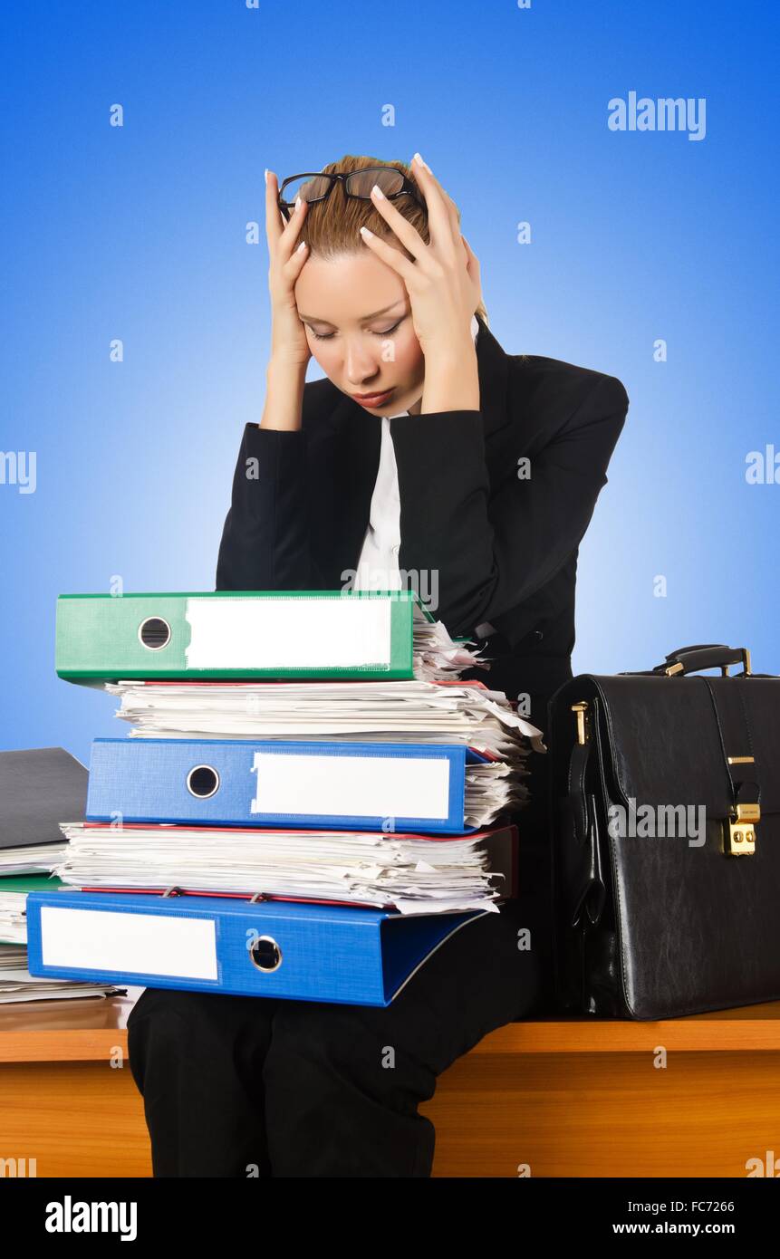 Woman with lots of work Stock Photo - Alamy
