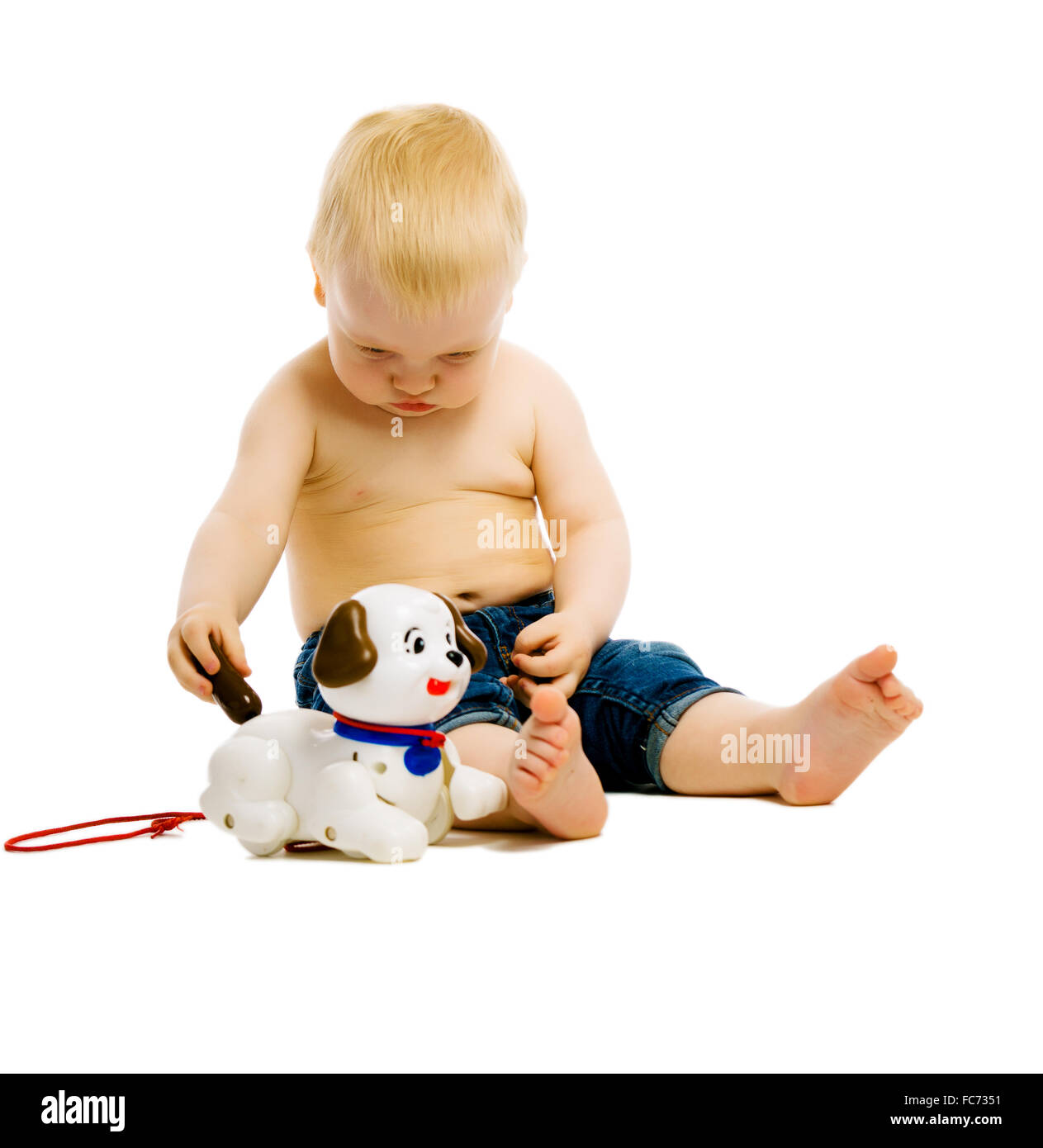 Baby boy playing with toys. isolated Stock Photo - Alamy