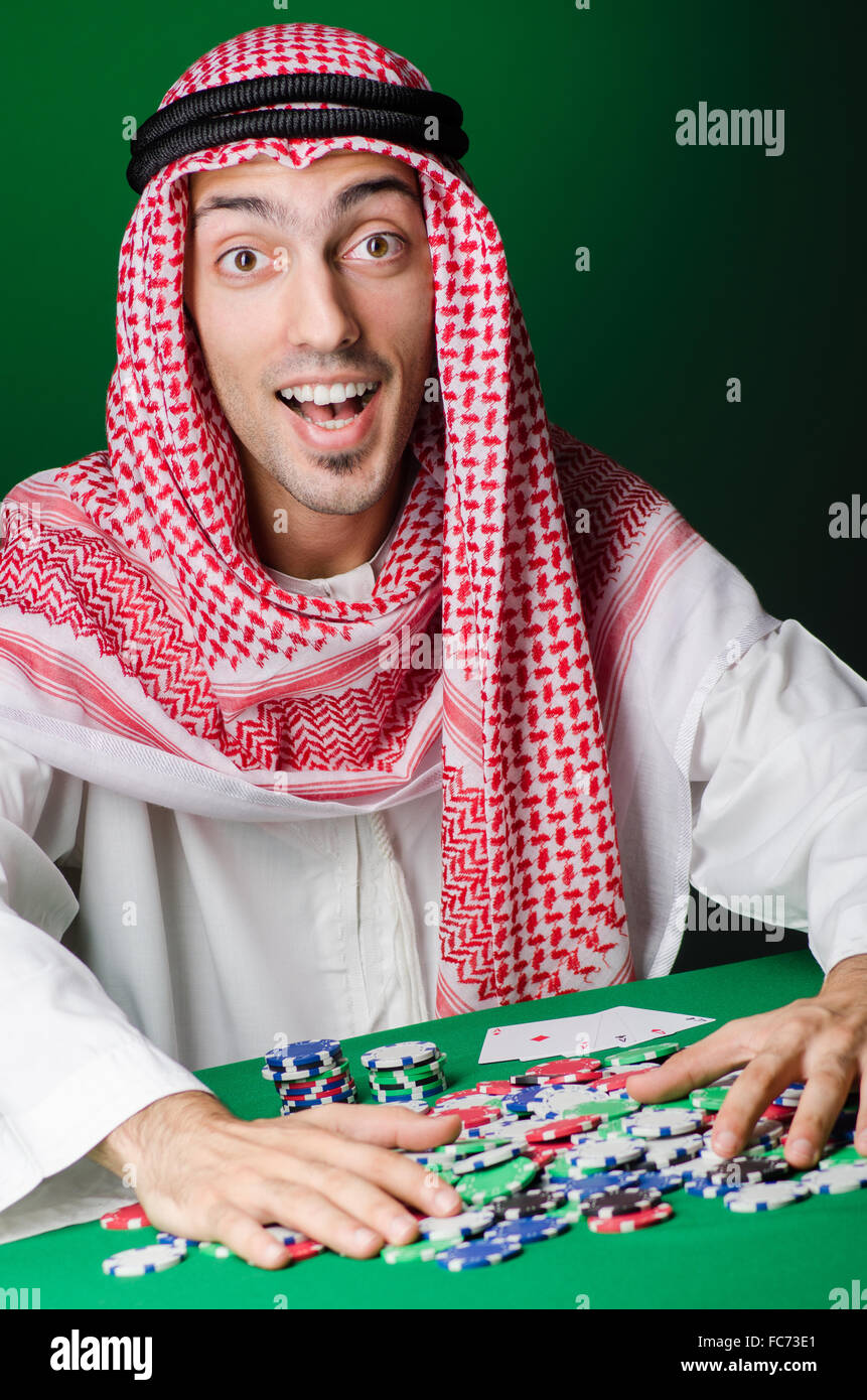 Arab man playing in the casino Stock Photo - Alamy