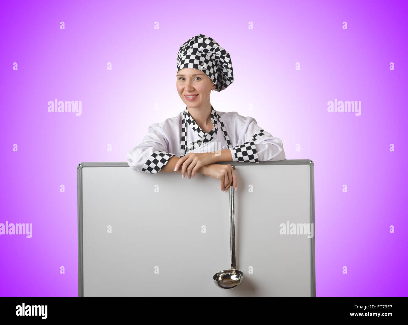 Cook with ladle and blank board Stock Photo - Alamy