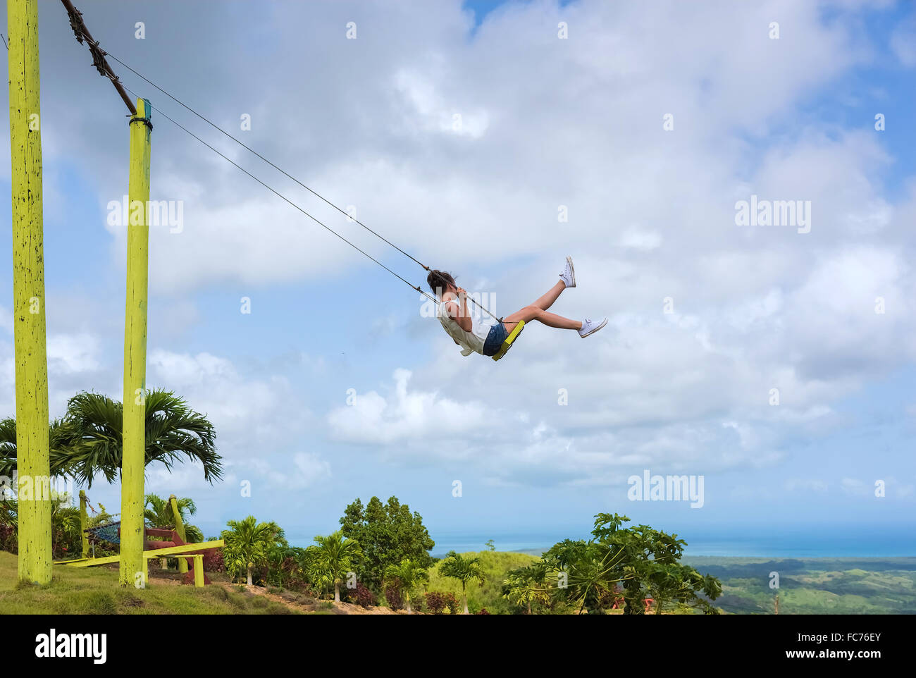 Woman swinging high Stock Photo - Alamy