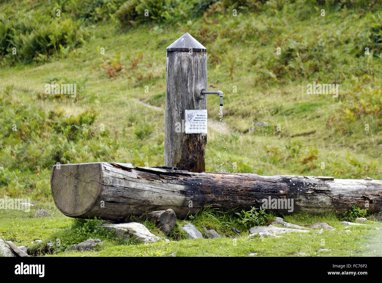 wooden well with flowing water Stock Photo - Alamy