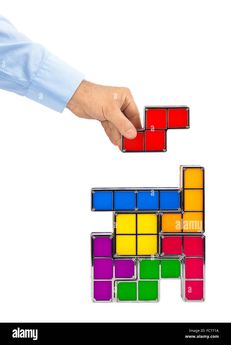 Hand with tetris toy blocks Stock Photo - Alamy
