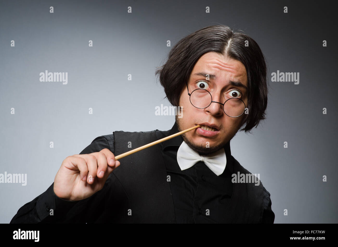 Funny conductor in musical concept Stock Photo - Alamy