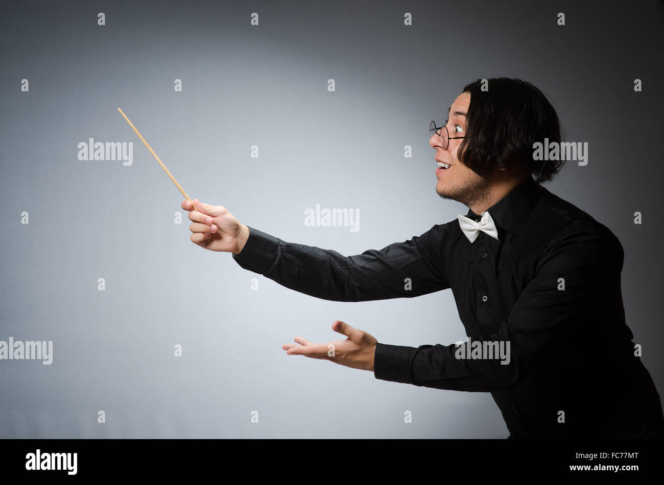 Funny conductor in musical concept Stock Photo - Alamy