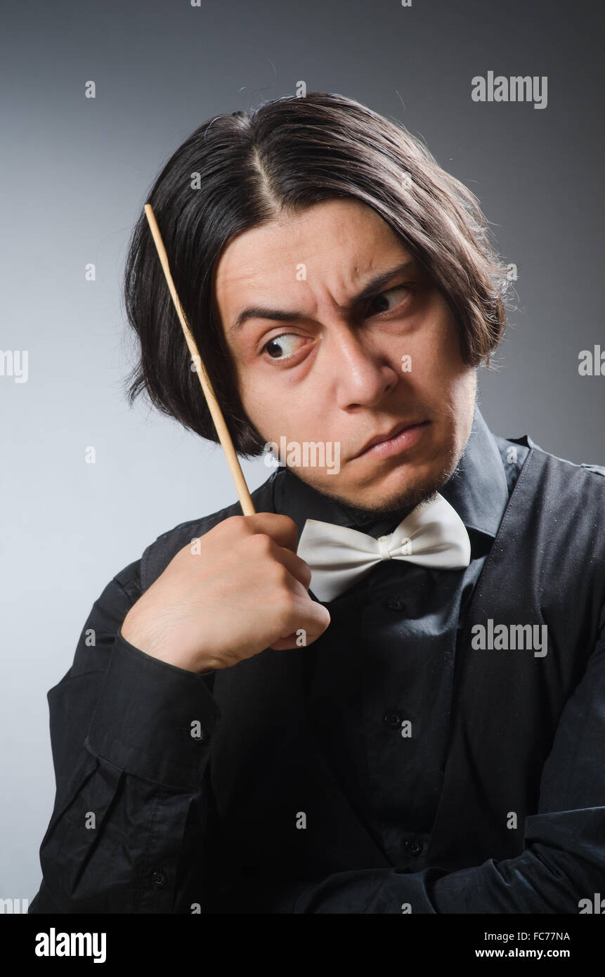 Funny conductor in musical concept Stock Photo - Alamy