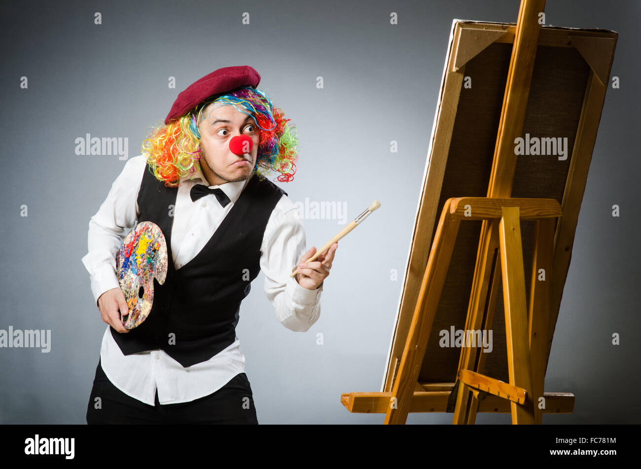 Funny artist in dark studio Stock Photo - Alamy